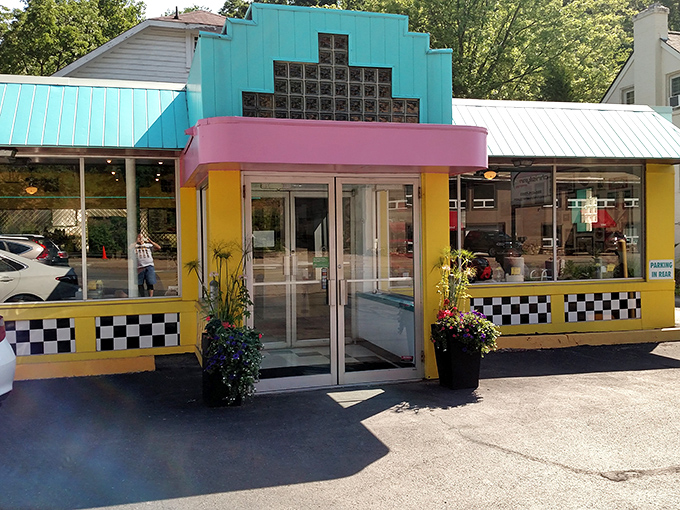 The turquoise and yellow exterior of Valliant's Diner stands out like a Technicolor dream in Pittsburgh's landscape, beckoning hungry travelers with retro charm.