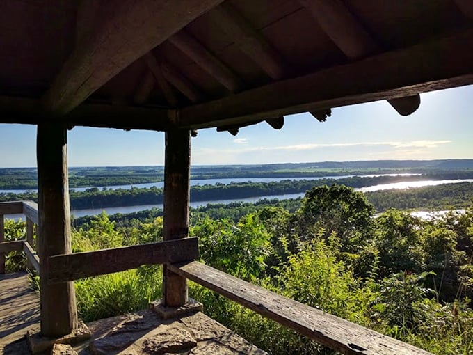 Nature's balcony awaits! From this rustic overlook, the mighty Mississippi and Illinois Rivers converge in a view that makes smartphone cameras weep with inadequacy.
