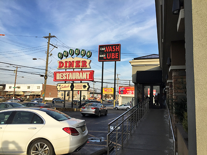 The iconic Oregon Diner sign stands proud against the Philly sky, beckoning hungry travelers with promises of comfort food paradise.