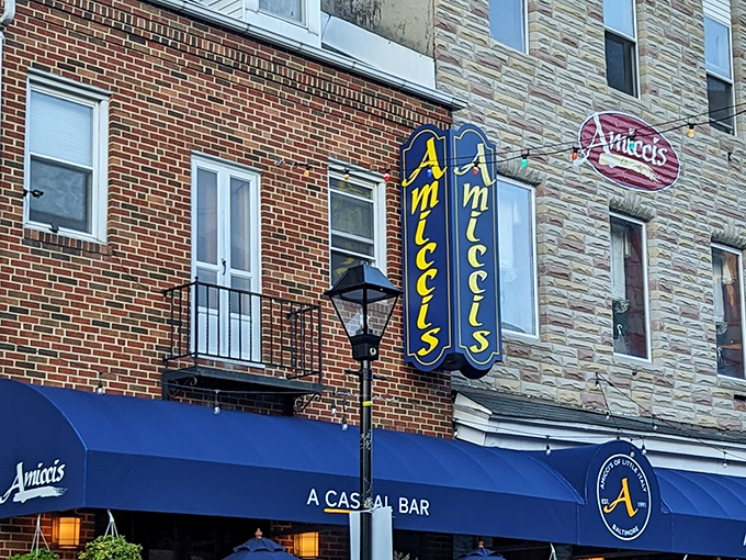That blue awning beckons like a beacon of Italian comfort in Baltimore's historic Little Italy neighborhood.