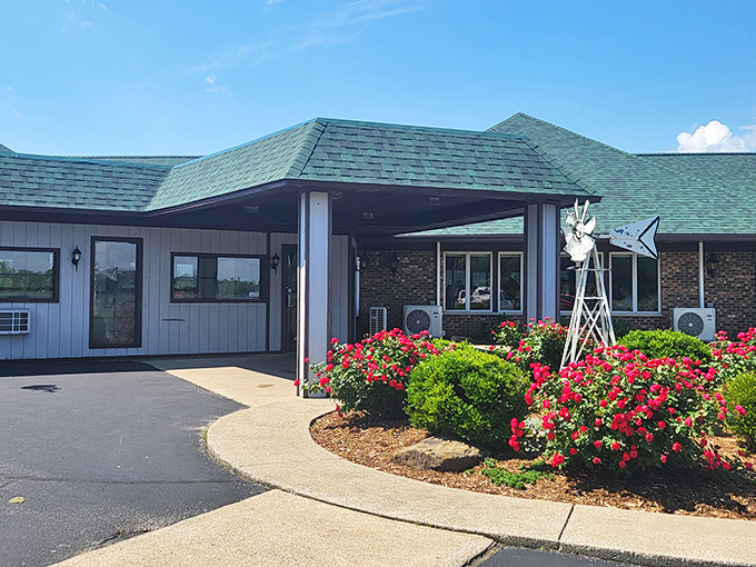 The green-roofed welcome of Stoll's stands like a culinary lighthouse, complete with windmill and flowers that seem to say, "Yes, good decisions were made today."