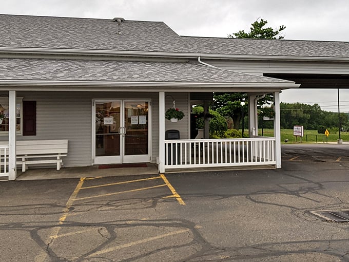 The iconic red-striped roof of Dutch Kitchen welcomes hungry travelers like a beacon of comfort food hope in Amish Country.