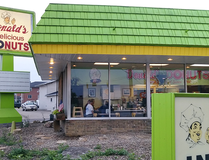 The unmistakable green beacon of breakfast bliss. Donald's distinctive exterior has been calling to donut lovers since 1960, like a sugary lighthouse guiding hungry ships to shore.