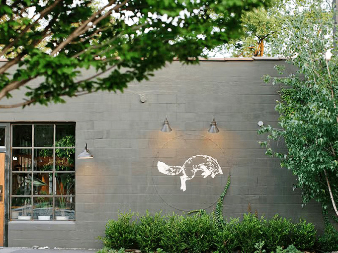 The unassuming gray exterior with its illuminated fox logo is like finding a secret clubhouse for pastry enthusiasts.