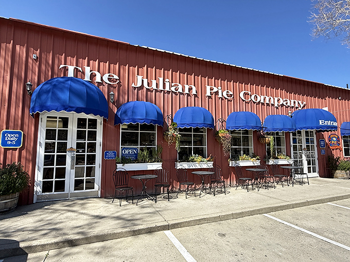 The iconic red exterior with bright blue awnings beckons pie lovers like a beacon of hope in a world of mediocre desserts.