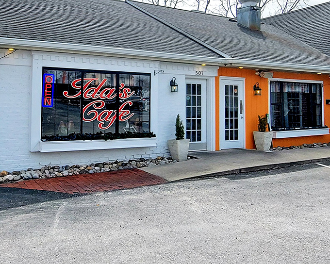 The orange and white facade of Ida's Cafe beckons like a culinary lighthouse, promising comfort and satisfaction to hungry travelers on Rohrerstown Road.