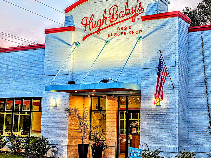 The white brick fortress of flavor! Hugh-Baby's crisp exterior with its bold red trim promises burger paradise before you even step inside.
