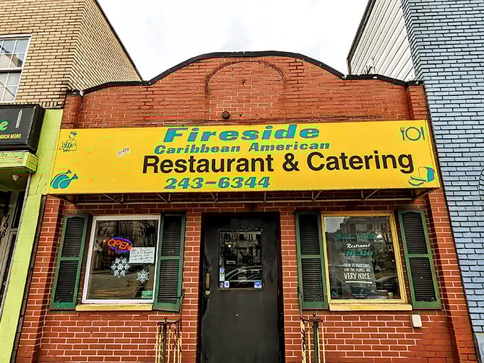 The bright yellow sign beckons like a tropical sun in Pittsburgh's urban landscape, promising Caribbean flavors that transport you far beyond Pennsylvania.