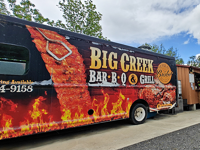 The Big Creek Bar-B-Q bus isn't subtle about its mission - it's a flame-wrapped barbecue battleship ready to launch a full-scale assault on your hunger.