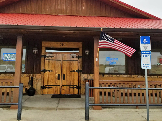 The rustic wooden exterior with its signature red roof isn't trying to impress anyone&mdash;until you taste what's happening inside. Florida barbecue with purpose.