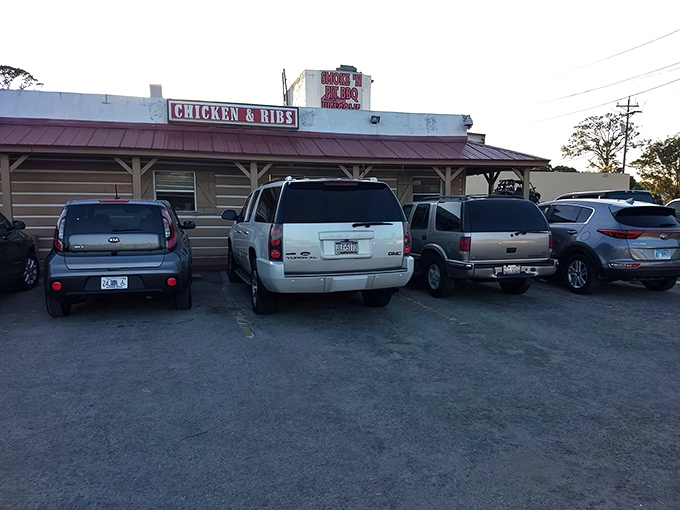 The unassuming wooden exterior of Smoke'n Pit screams "authentic barbecue inside!" Those rooftop signs aren't lying&mdash;this place means serious meat business.