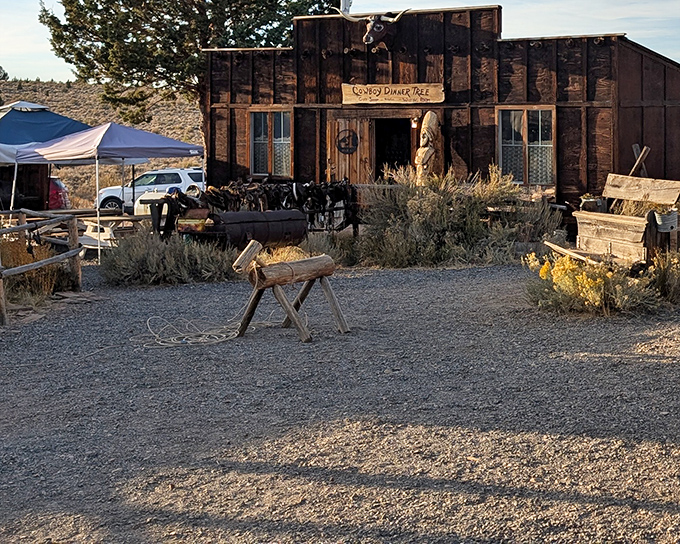 The rustic exterior of Cowboy Dinner Tree stands defiant against the high desert, like a time capsule of the Old West waiting to welcome hungry travelers.