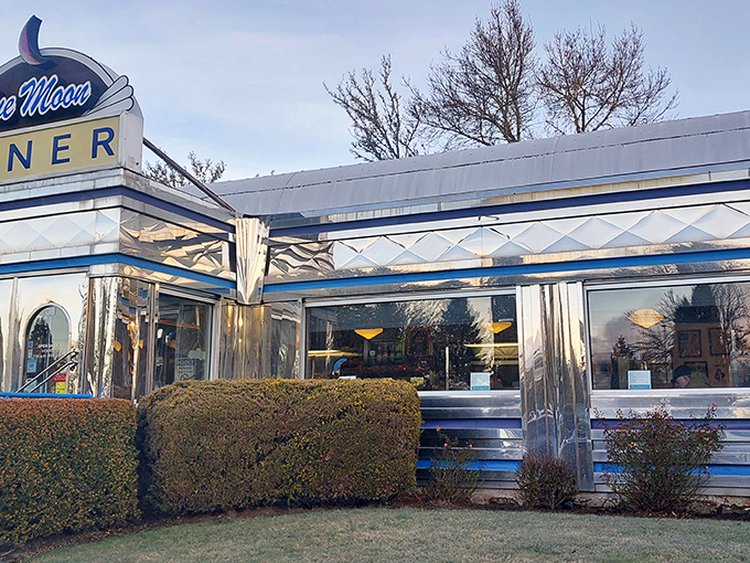 The gleaming chrome exterior of Blue Moon Diner shines like a beacon of breakfast hope, complete with that iconic blue crescent moon sign calling hungry Oregonians home.