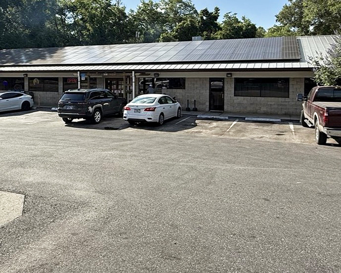 You might miss it if you’re not looking, but behind this no-frills exterior lies a hidden BBQ gem. No smoke show out front—just the kind that comes from the pit inside.