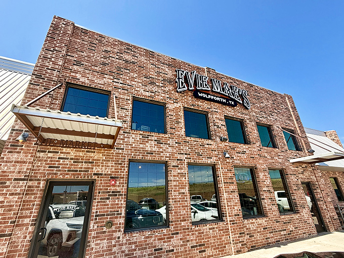 The brick fortress of flavor that houses Evie Mae's stands proudly against the Texas sky, a beacon for barbecue pilgrims seeking smoked meat salvation.