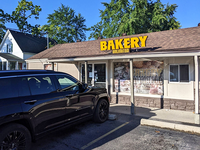 The bright yellow sign of Bakery Unlimited beckons like a sugary lighthouse on Toledo's horizon. Sweet salvation awaits inside!