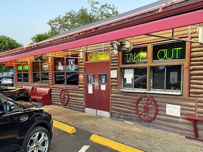 The neon glow of Shiver's BBQ sign is like a smoky lighthouse guiding hungry souls to barbecue paradise. No fancy frills, just the promise of meaty delights within.