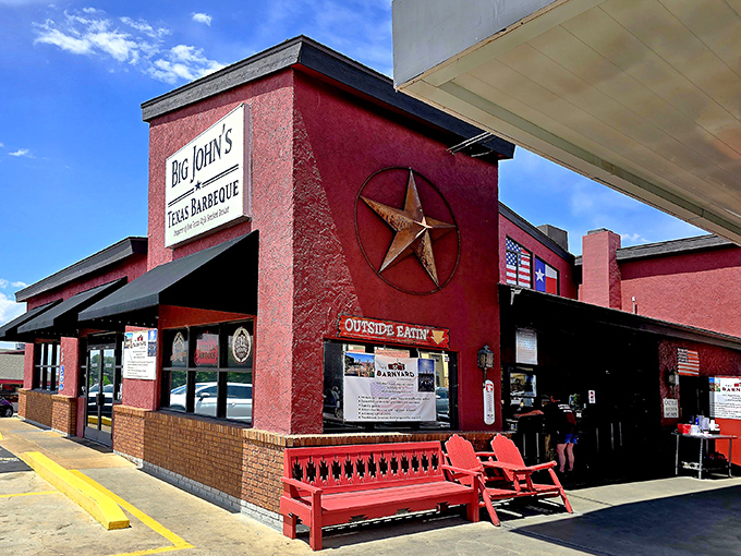 The unmistakable red exterior of Big John's Texas BBQ stands like a beacon for hungry travelers in Page, Arizona. BBQ paradise found!