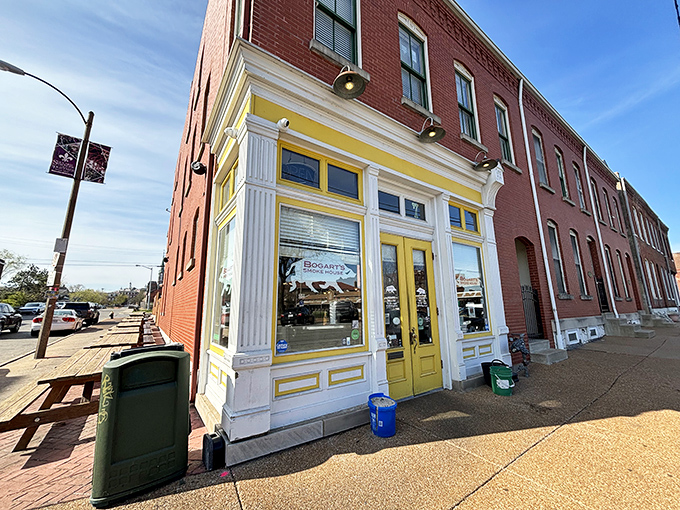 The bright yellow trim of Bogart's Smokehouse beckons like a BBQ lighthouse in Soulard, with picnic tables ready for the feast ahead.