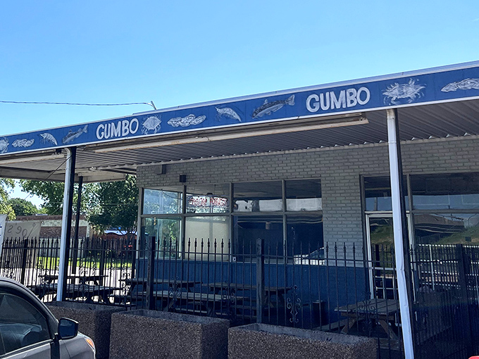 The blue awning with "GUMBO" repeated like a delicious mantra tells you everything you need to know about this Dallas treasure.