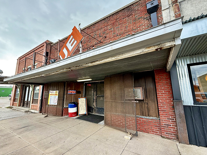 The brick facade of barbecue royalty stands proudly in Taylor, where that Texas flag and simple "BARBECUE" sign tell you everything you need to know.