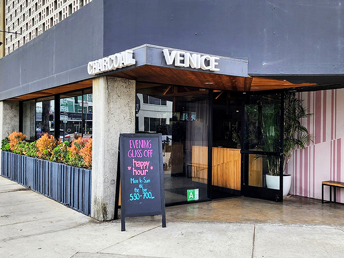 The blue facade of Charcoal Venice promises what lies within&mdash;a temple to flame-kissed cuisine and those legendary bottomless mimosas for weekend warriors.