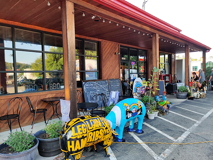The red metal roof of Mitch's BBQ stands like a beacon to hungry travelers, promising smoky delights within this unassuming Warrendale treasure.