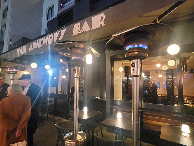The Anchovy Bar's inviting exterior beckons seafood lovers with its understated elegance. Those outdoor tables? Prime real estate for San Francisco people-watching while savoring oceanic delights.