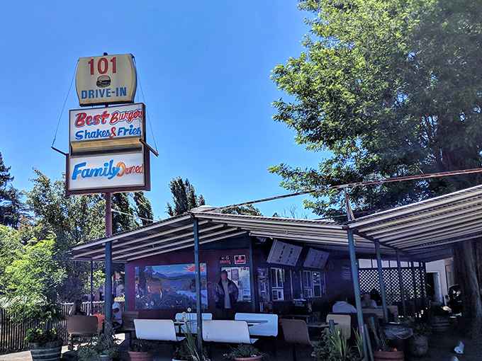 The iconic 101 Drive-In sign stands tall against the California sky, promising burger bliss to weary travelers and locals alike.