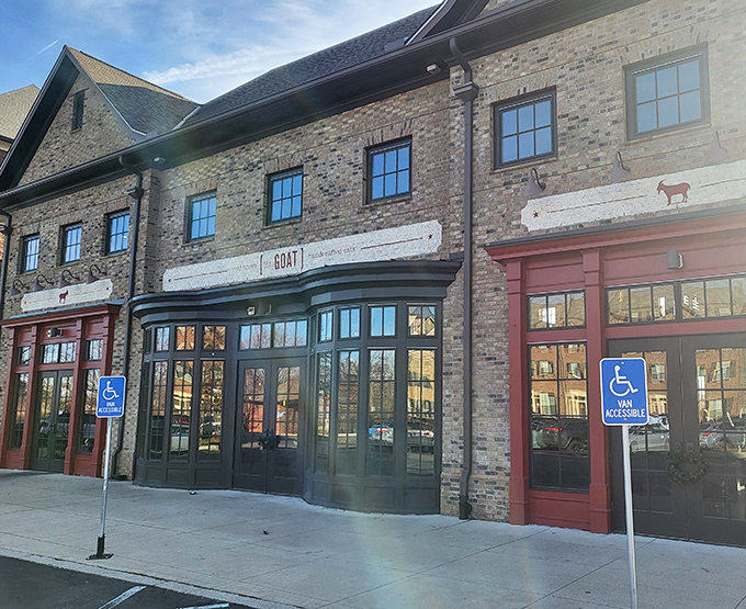 The brick façade with those eye-catching red doorframes isn't just inviting—it's practically shouting "Get in here and eat something amazing!"