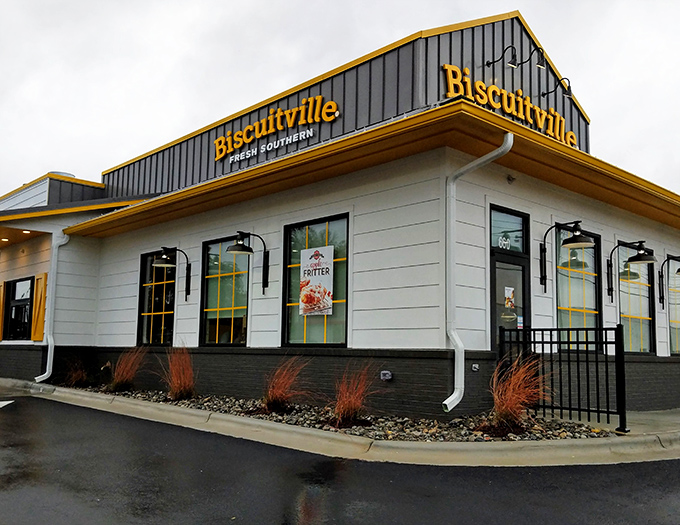 The bright yellow Biscuitville sign stands out like a breakfast beacon, promising Southern comfort in biscuit form to hungry North Carolinians.