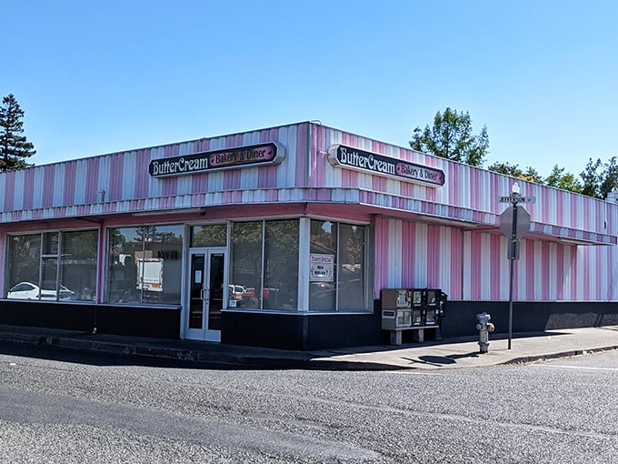 The pink-and-white striped exterior of Butter Cream isn't just a building&mdash;it's a promise of nostalgic delights waiting inside. Like a dessert come to life!