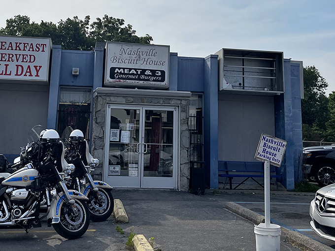 The unassuming blue facade of Nashville Biscuit House promises breakfast treasures within. Like finding a secret jazz club, the real magic happens once you step inside.