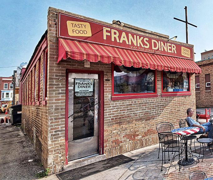 Frank's Diner stands proudly in downtown Kenosha, its brick exterior and cherry-red awning beckoning hungry travelers like a culinary lighthouse on Lake Michigan's shore.