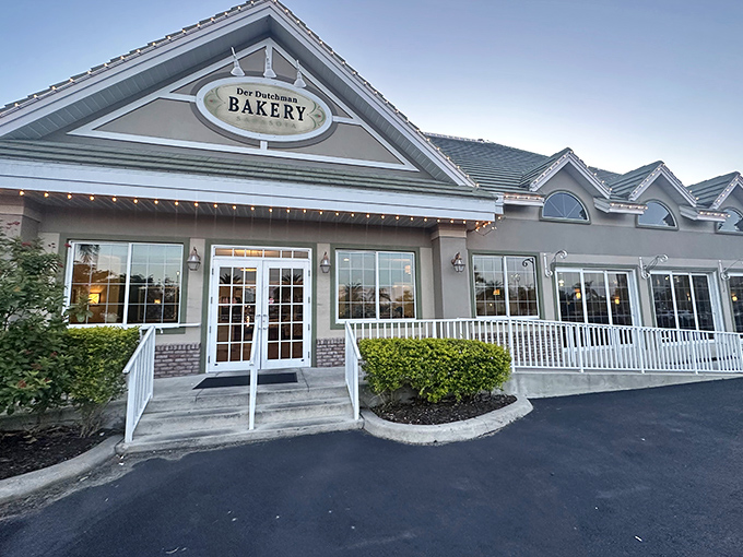 Der Dutchman's welcoming exterior promises comfort food paradise with its distinctive green roof and inviting front porch&mdash;architectural amuse-bouche for the feast within.