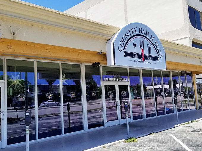 The unassuming storefront of Country Ham N' Eggs might not stop traffic, but locals know this Fort Lauderdale gem houses breakfast treasures worth their weight in liquid gold (coffee, that is).
