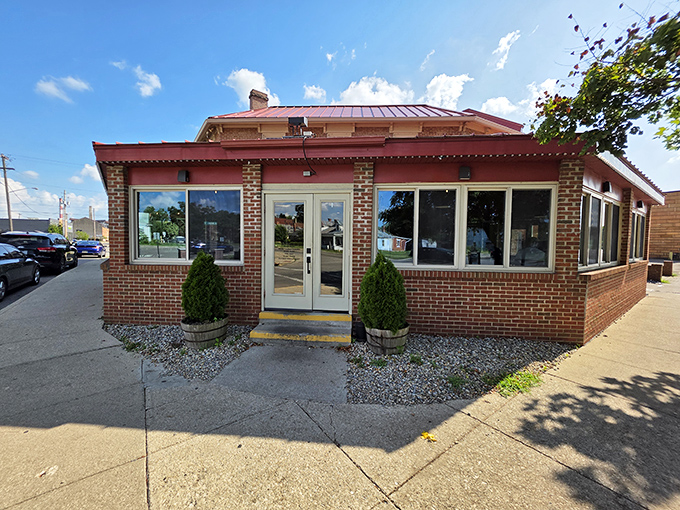The brick exterior of Old Canal Smoke House beckons like a BBQ lighthouse on Chillicothe's horizon. Those twin evergreens aren't just decorative&mdash;they're standing guard over smoky treasures within.