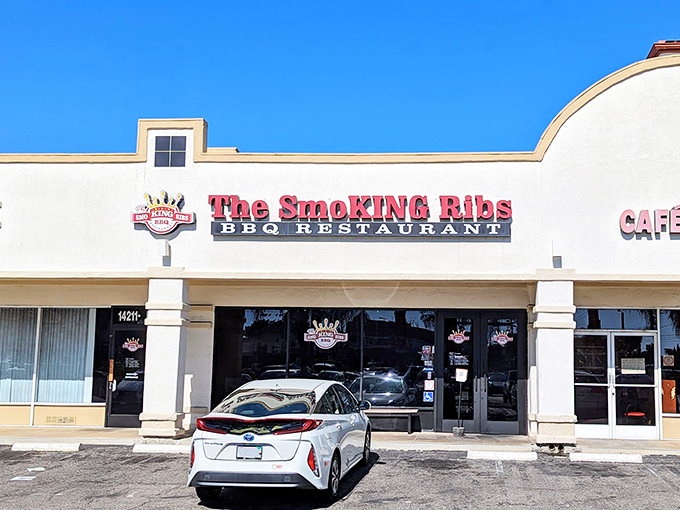 The unassuming storefront belies the smoky treasures within. Like finding a diamond in a strip mall, The Smoking Ribs' sign promises delicious things to come.