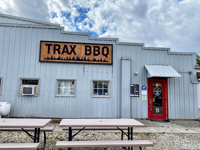 The unassuming exterior of Trax BBQ proves once again that the best barbecue joints often hide in plain sight, like culinary speakeasies of smoke and meat.