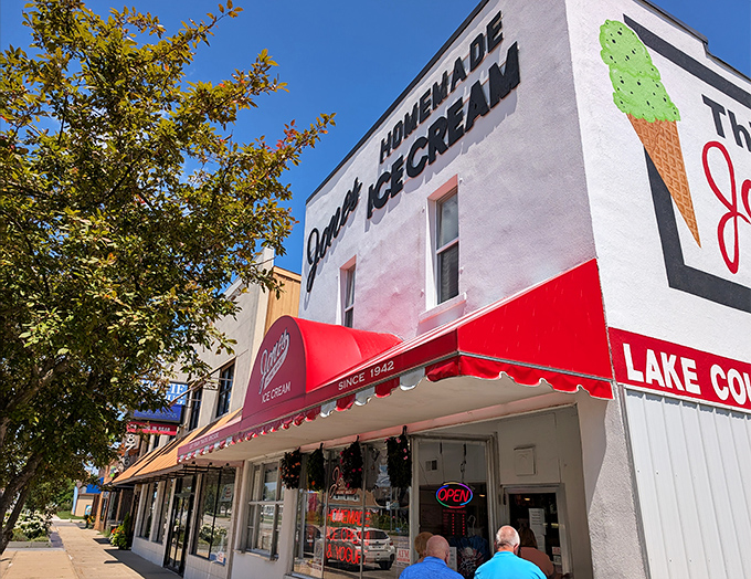 The iconic storefront of Jones' Homemade Ice Cream stands proudly in Baldwin, a beacon of dairy delight with its unmistakable red awning and vintage charm.
