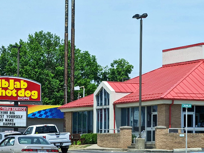The iconic red roof of Jib Jab Hot Dog Shoppe stands as a beacon of hope for the hungry traveler. This Girard landmark promises comfort food paradise within.