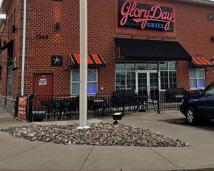 The brick exterior of Glory Days Grill welcomes hungry travelers with its no-nonsense charm and promise of comfort food that delivers.