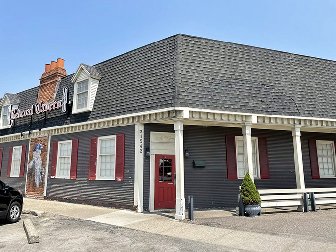 Colonial charm meets Midwest hospitality at Redcoat Tavern's distinctive exterior. That red door isn't just an entrance&mdash;it's a portal to culinary bliss. 
