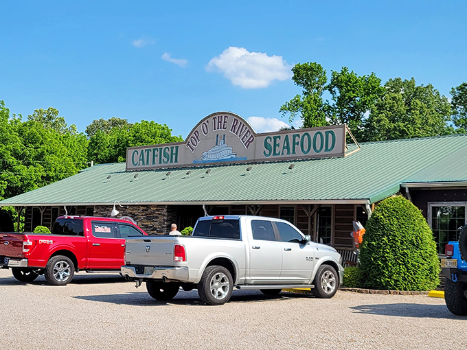 The rustic charm of Top O' The River beckons hungry travelers like a siren song for catfish enthusiasts. No fancy frills needed when the food speaks this loudly.