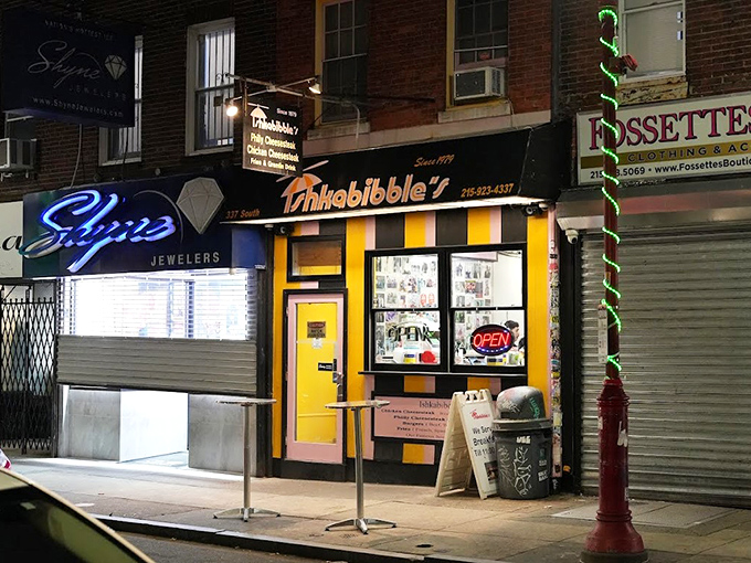 The unmistakable yellow and pink facade of Ishkabibble's stands out on South Street like a delicious beacon for hungry cheesesteak pilgrims.