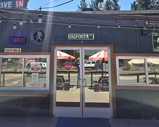 The classic blue exterior of Sno-Flake nestled among towering pines creates that perfect "vacation has officially begun" moment for Tahoe visitors.