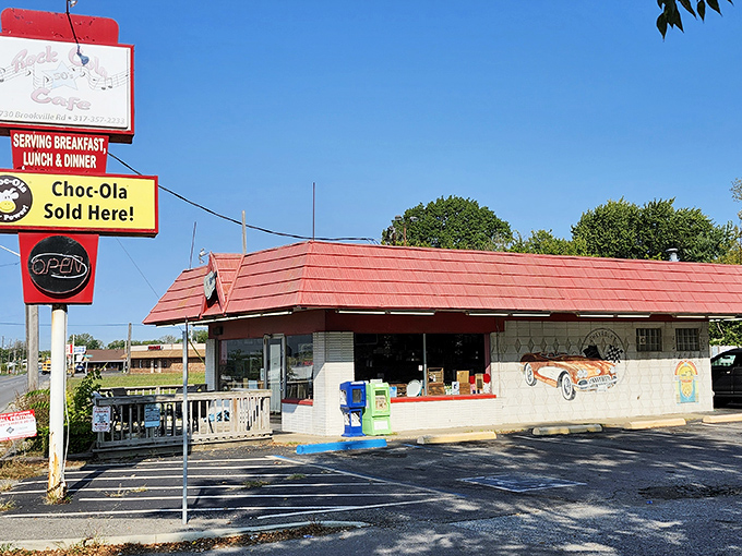 The classic red roof and vintage signage aren't just decoration—they're a time portal to when Elvis was king and milkshakes came with the metal mixing cup.