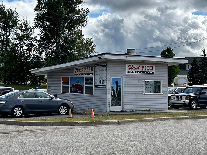 The unassuming exterior of West Pier Drive-In stands like a culinary lighthouse in Sault Ste. Marie, promising simple pleasures done extraordinarily well.