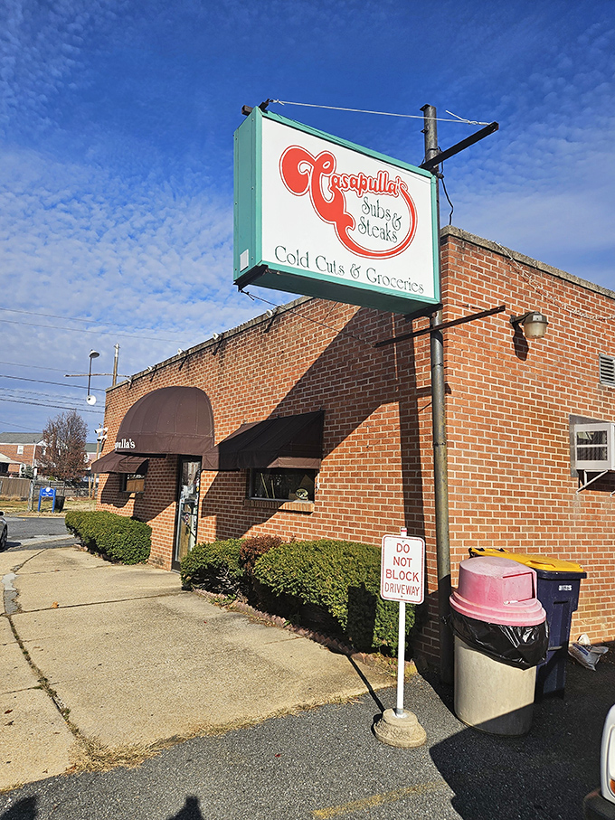 That classic brick facade and vintage signage whisper promises of sandwich perfection waiting inside.