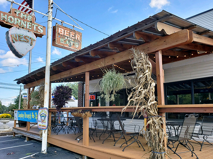 That vintage sign has seen better days, but like your favorite uncle's stories, it only gets more charming with age. The outdoor seating beckons with rustic simplicity.